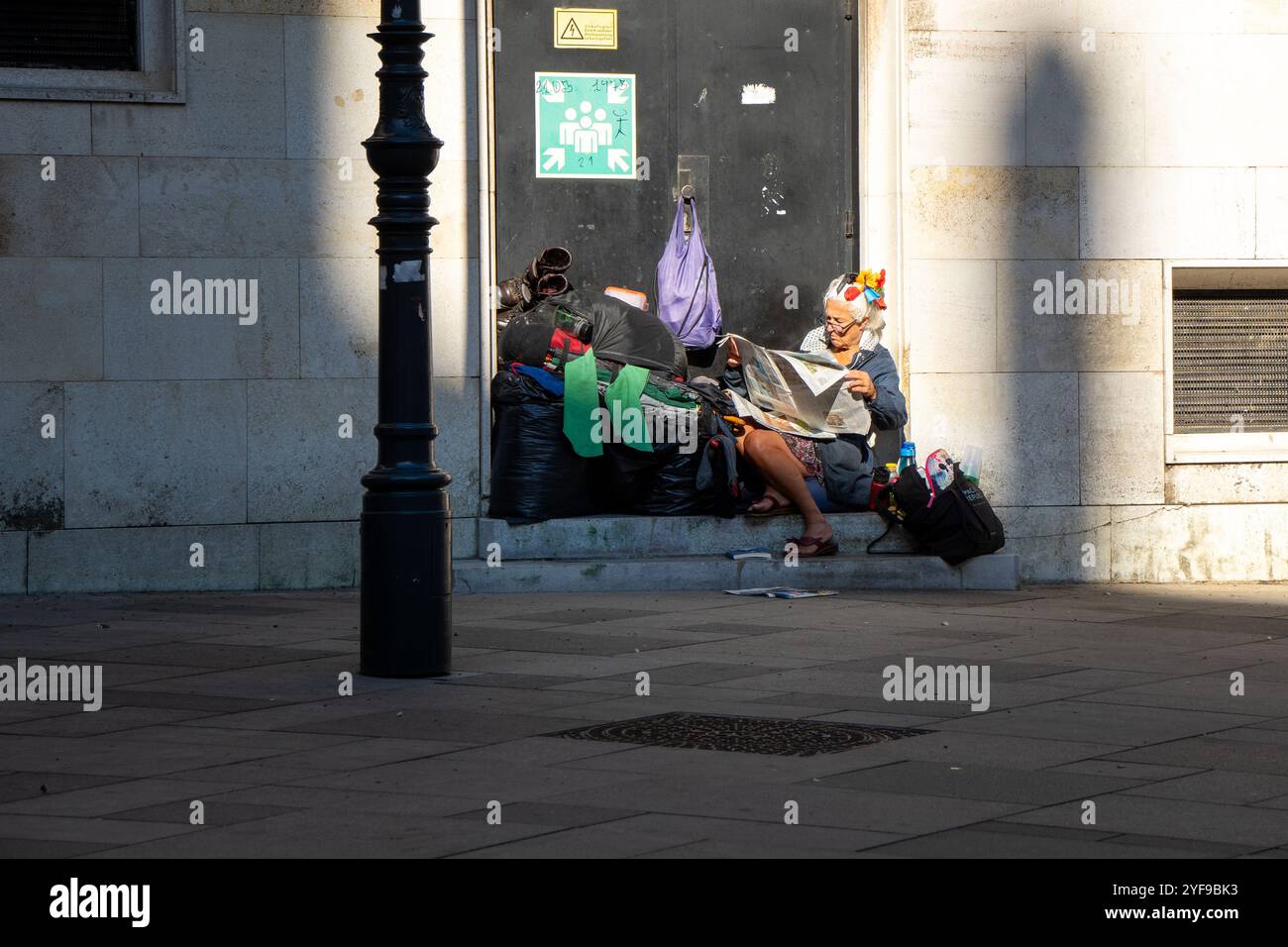 VIENNA, AUSTRIA - AUGUST 11, 2024: Homeless person wearing decorative ...