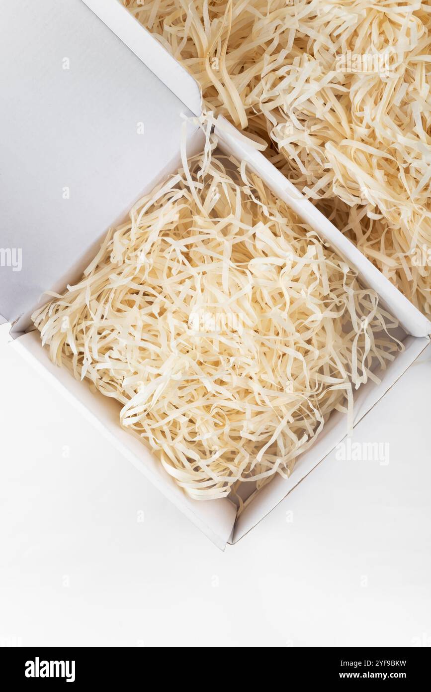 Confetti gift box filler in the box on white background Stock Photo - Alamy