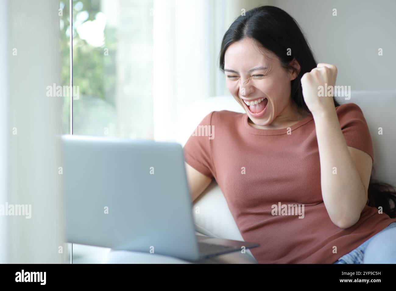 Excited woman computer home hi-res stock photography and images - Alamy
