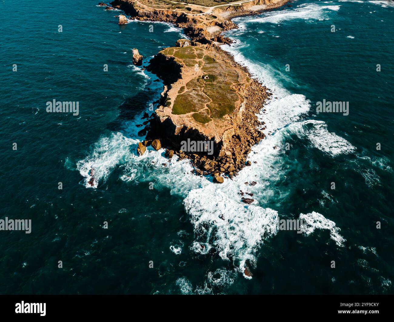 Areal view of atlantic ocean hitting the granite rocks on the coast ...