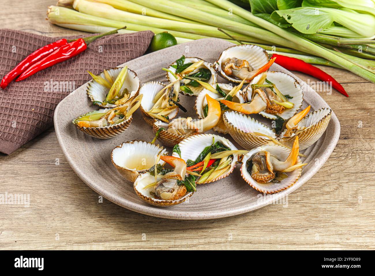 Delicous Asian mollusk shell steamed with spices Stock Photo - Alamy