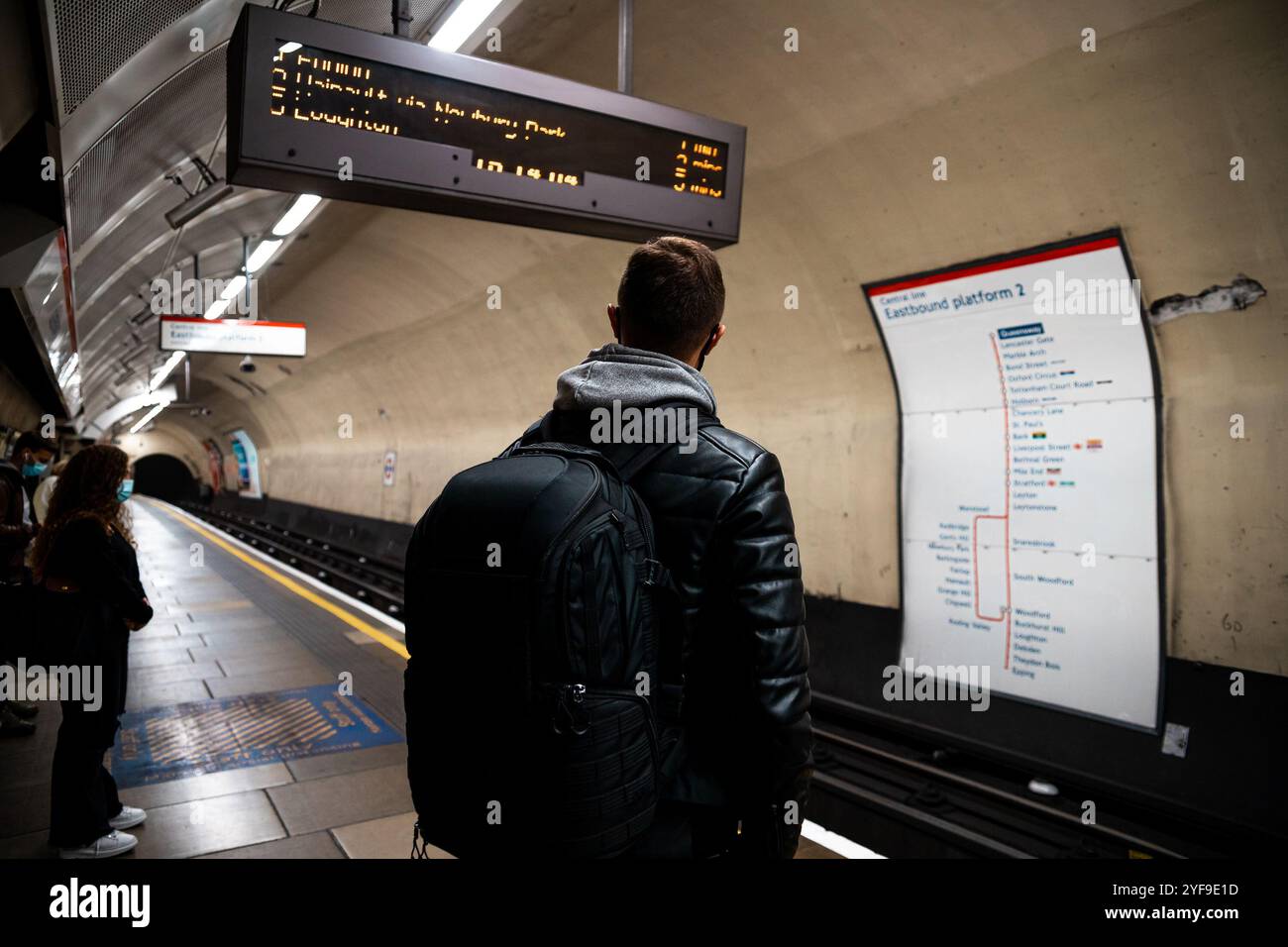 Back View of a Man Standing in a London Underground Station, Waiting for Train Arrival Stock ...