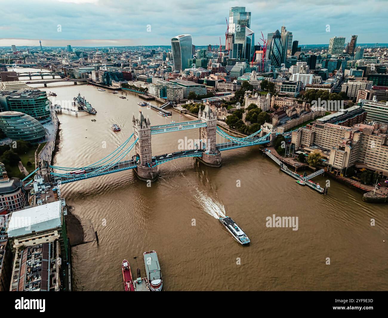Aerial view to the iconic Tower Bridge and skyline of London, UK ...