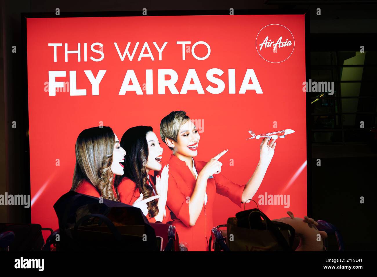 KUALA LUMPUR, MALAYSIA - MARCH 05, 2023: AirAsia poster as seen in ...