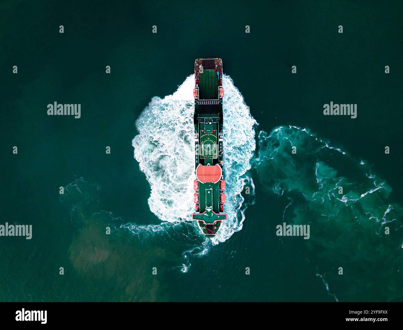 Aerial view of Empty cargo ship in port green water Stock Photo - Alamy