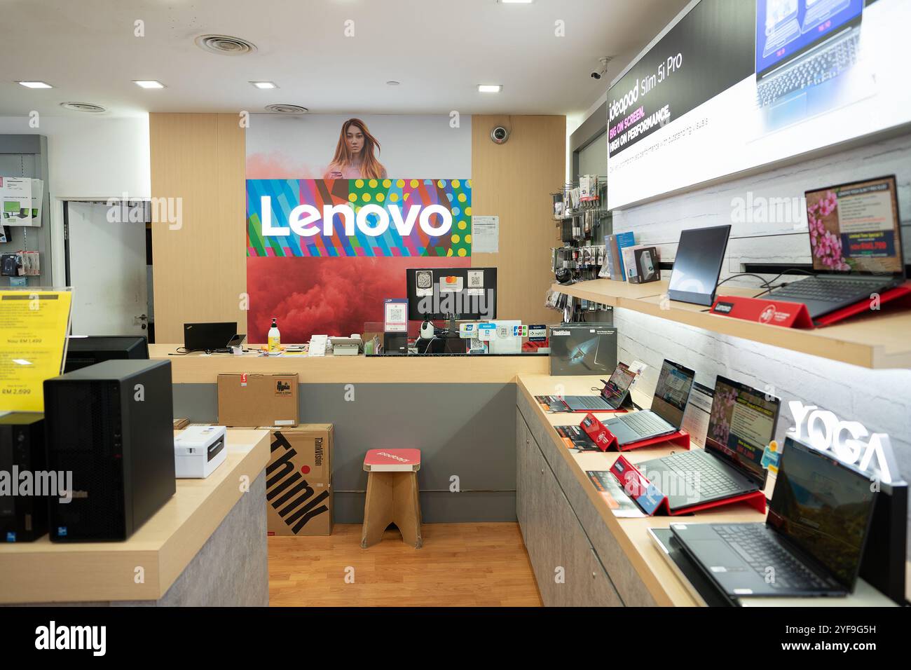 KUALA LUMPUR, MALAYSIA - MARCH 11, 2023: Lenovo laptops on display at a store in Kuala Lumpur ...