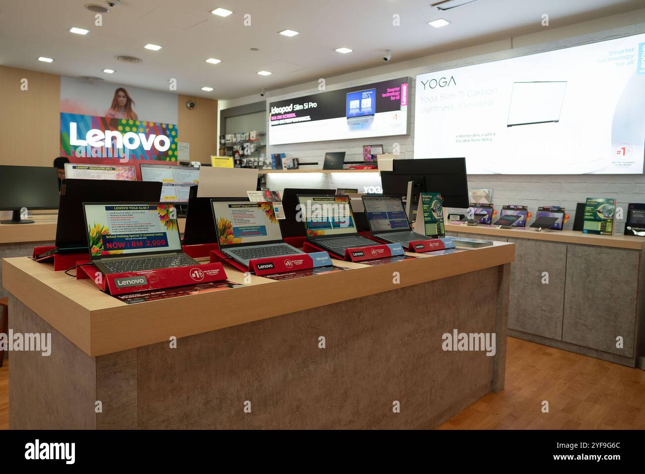 KUALA LUMPUR, MALAYSIA - MARCH 11, 2023: Lenovo laptops on display at a store in Kuala Lumpur ...
