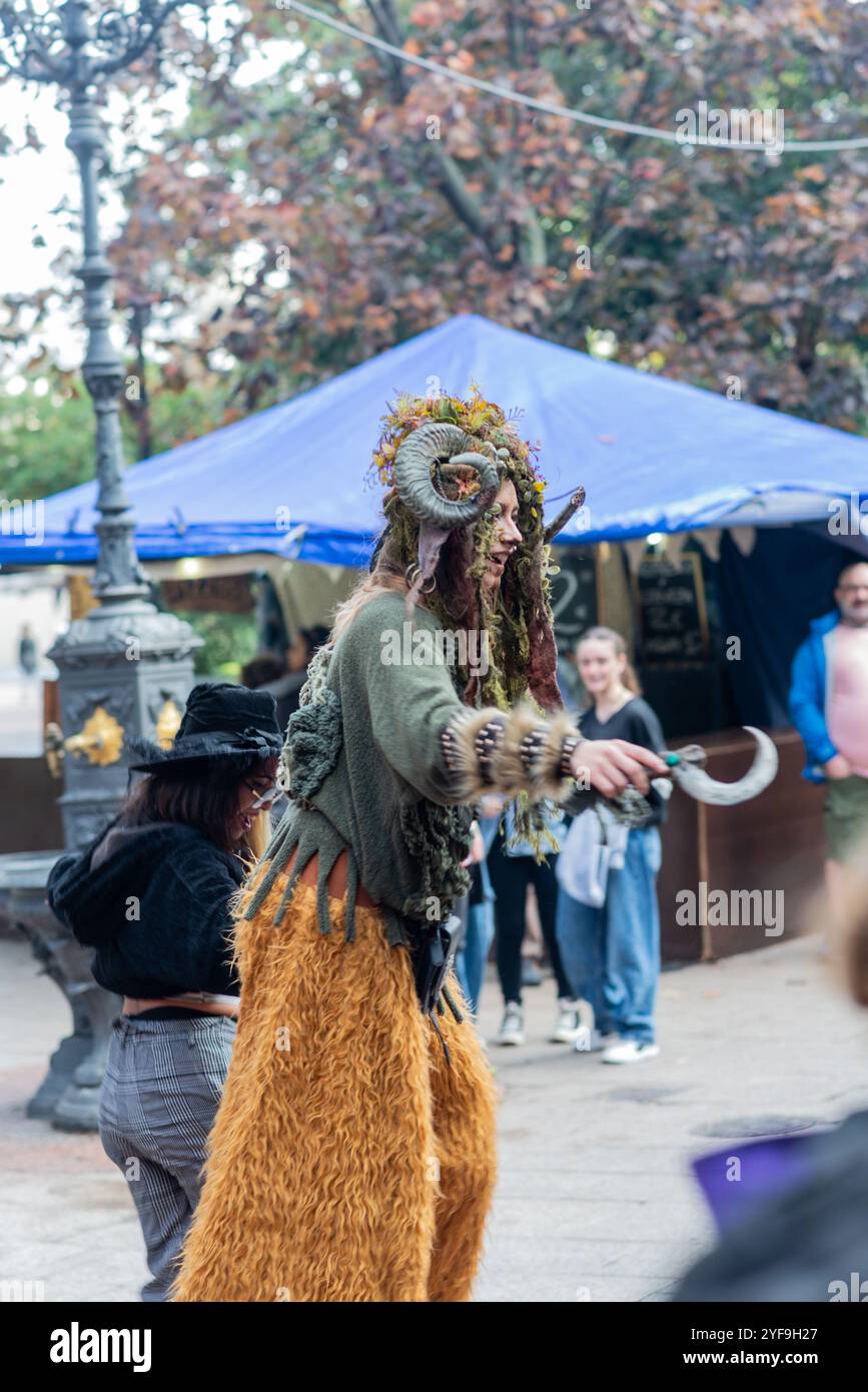 Street market with colorful medieval fair decorations in Barcelona ...