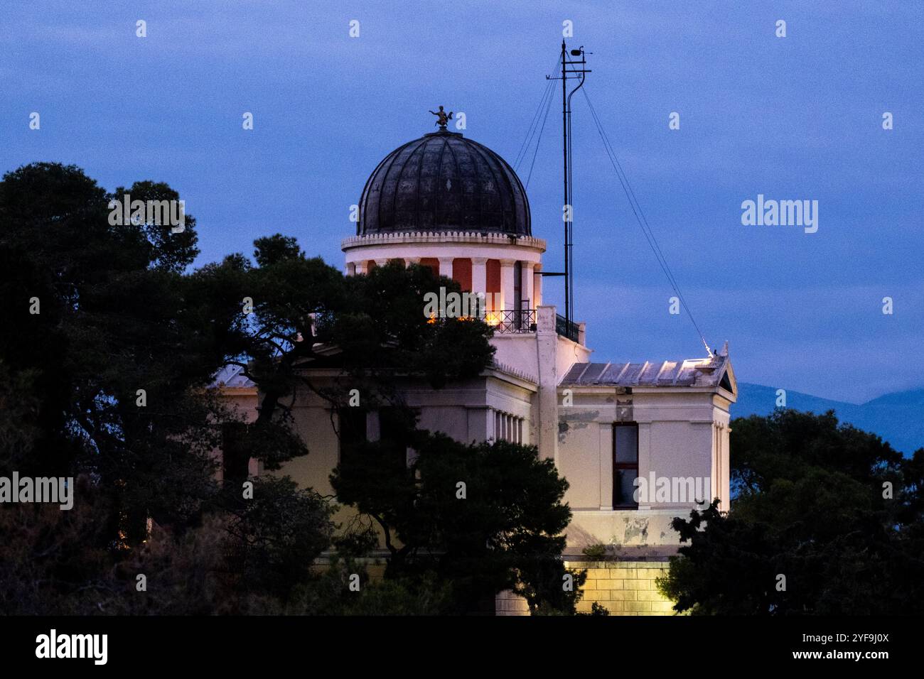 National Observatory at nightfall seen from the Ancient Agora of Athens ...
