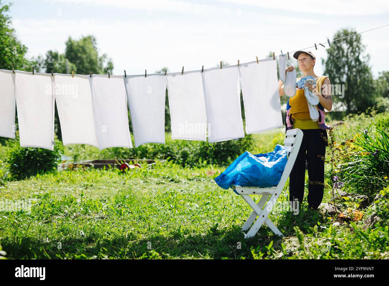 Baby clothes on washing line hi-res stock photography and images - Alamy