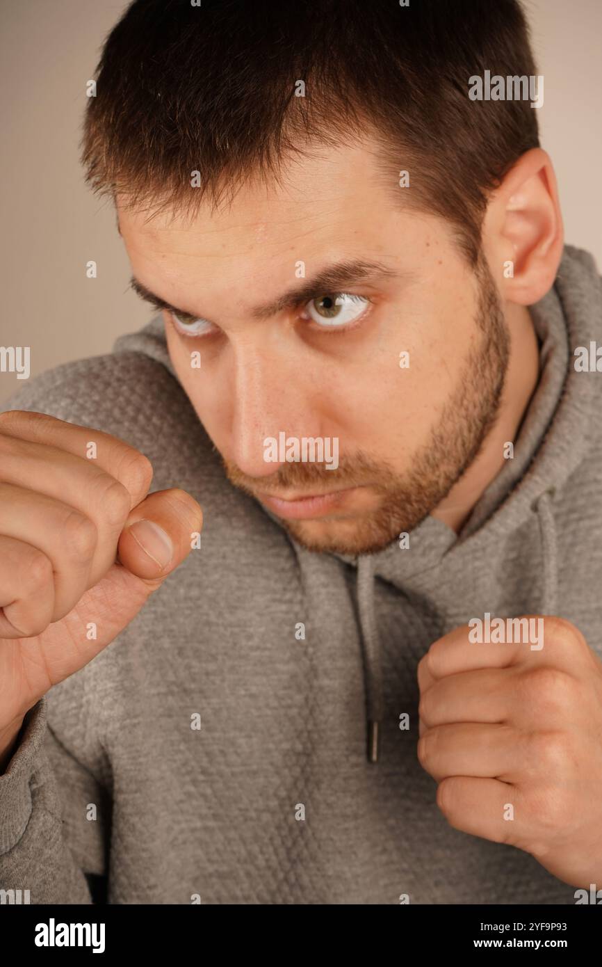 Bearded man stand with clenched fists. Standing in defensive position ...