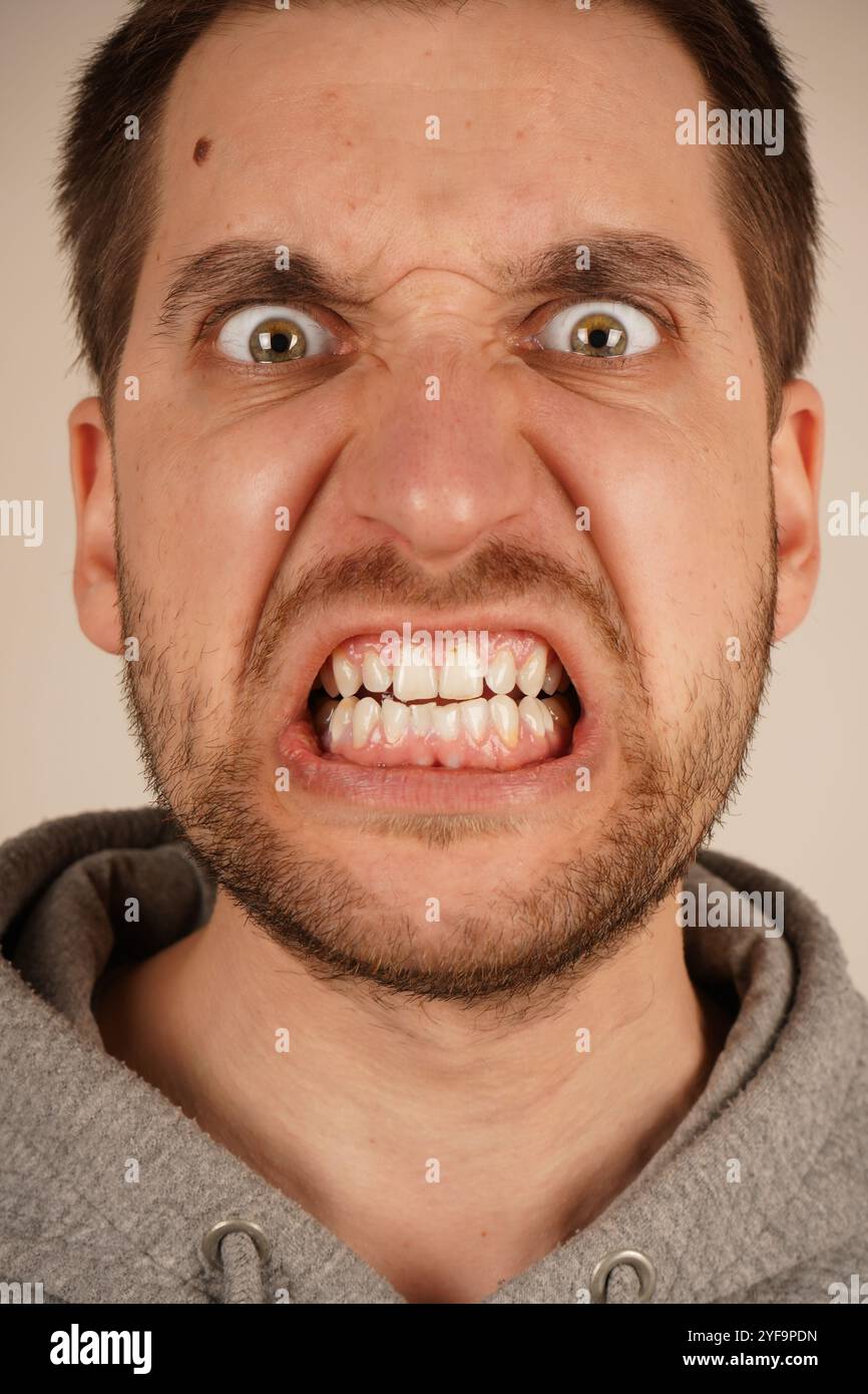 Portrait of frustrated angry man. Guy with dissatisfaction shows ...