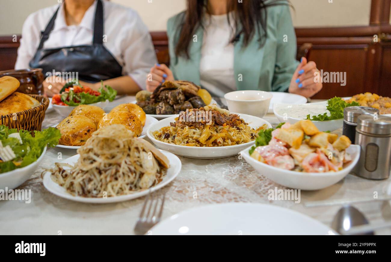 Assorted Uzbek food set, pilaf, samsa, lagman, manta, shurpa central ...