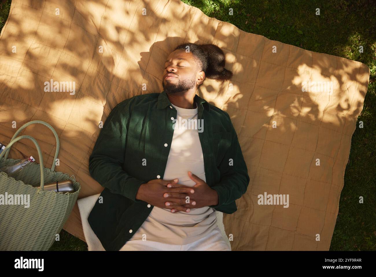 Person napping in park hi-res stock photography and images - Alamy