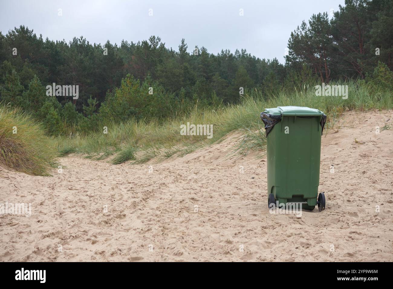Garbage box in sand hi-res stock photography and images - Alamy
