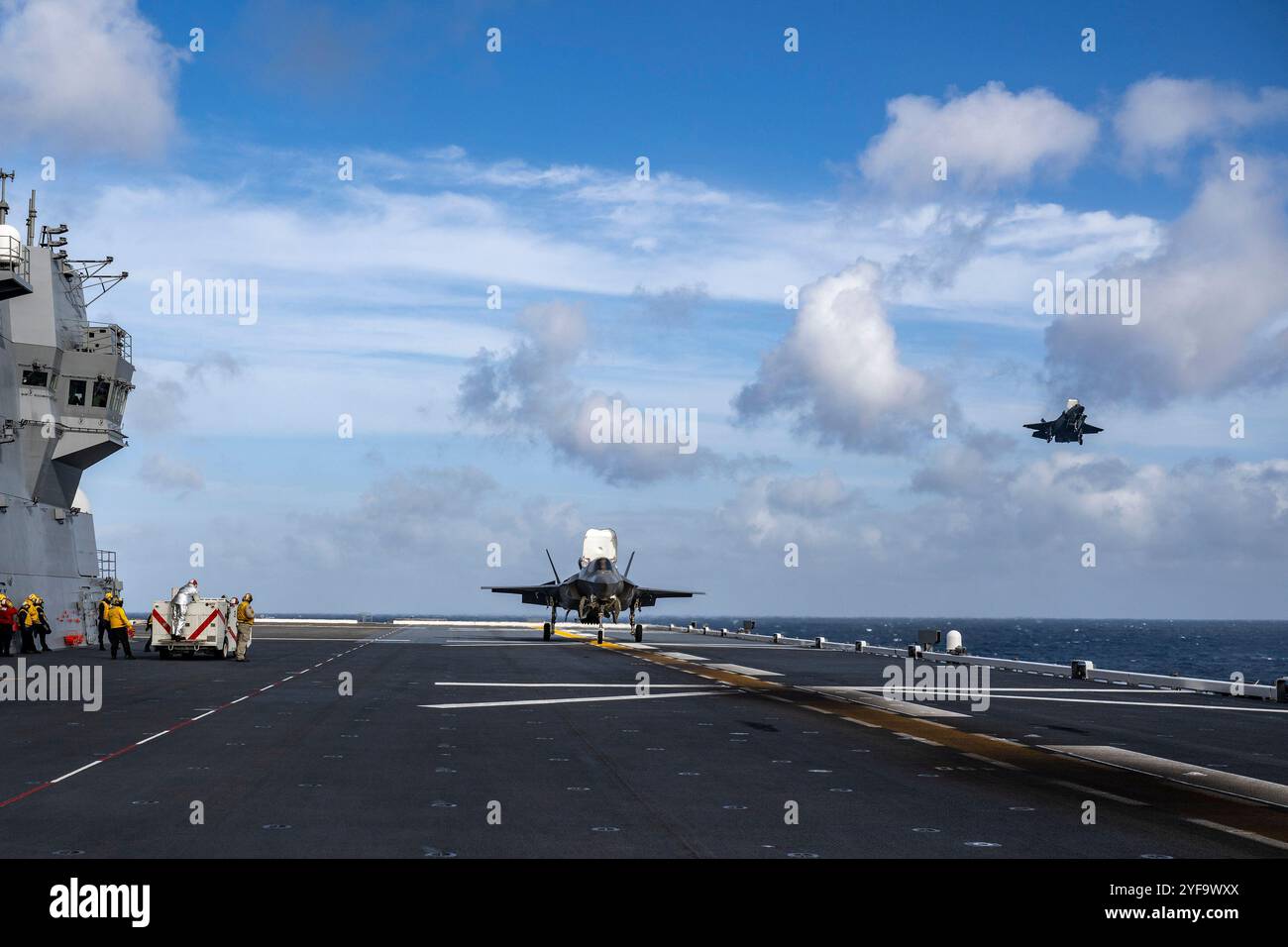 An F-35B Lightning II aircraft executes a vertical landing aboard Japan ...
