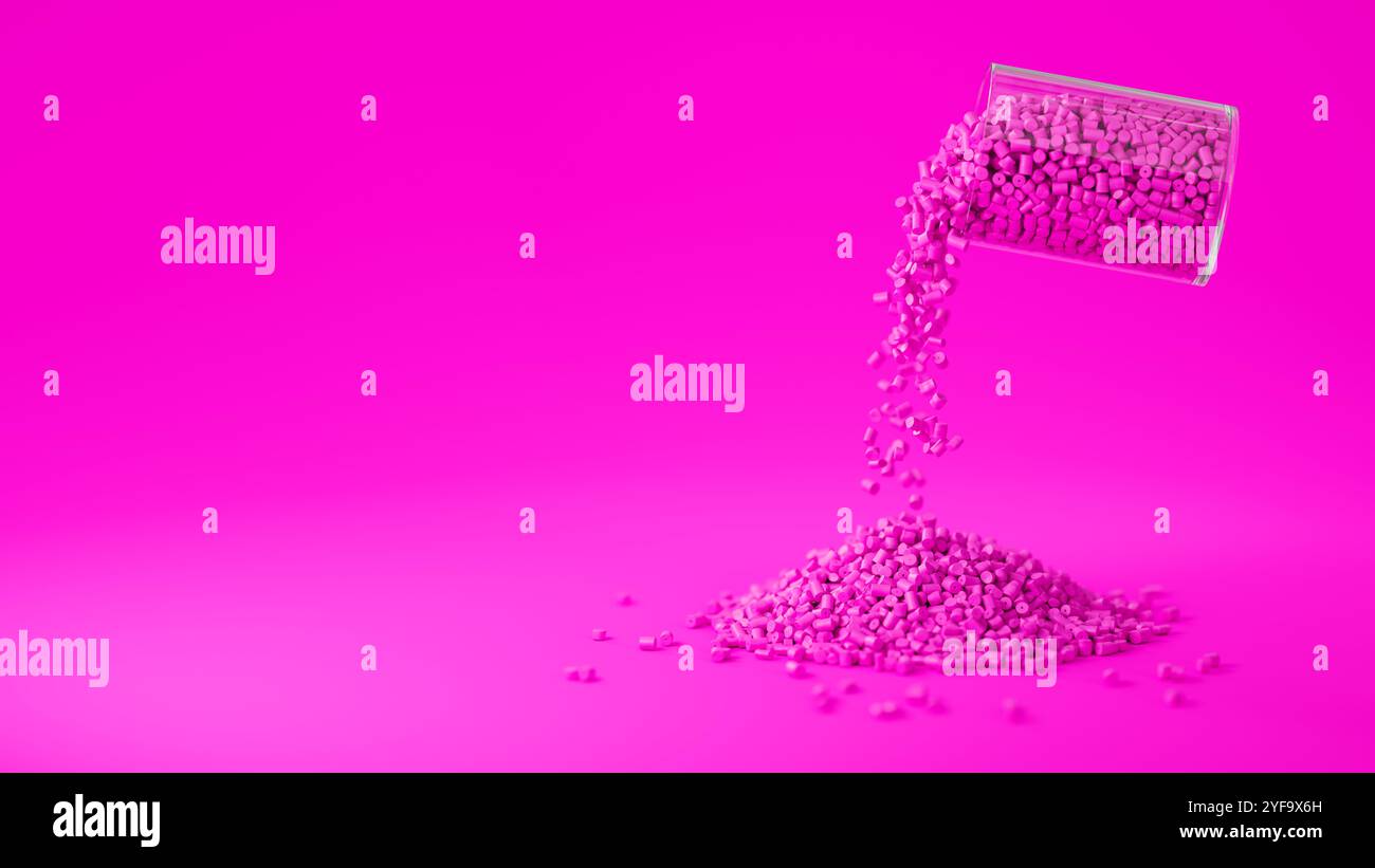 Pink plastic polypropylene granules pouring from the glass on a pink ...