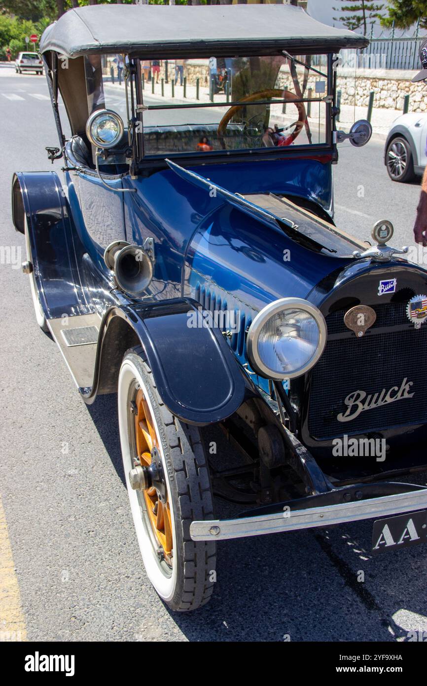 Vintage blue buick convertible parked on a paved road, showcasing its ...