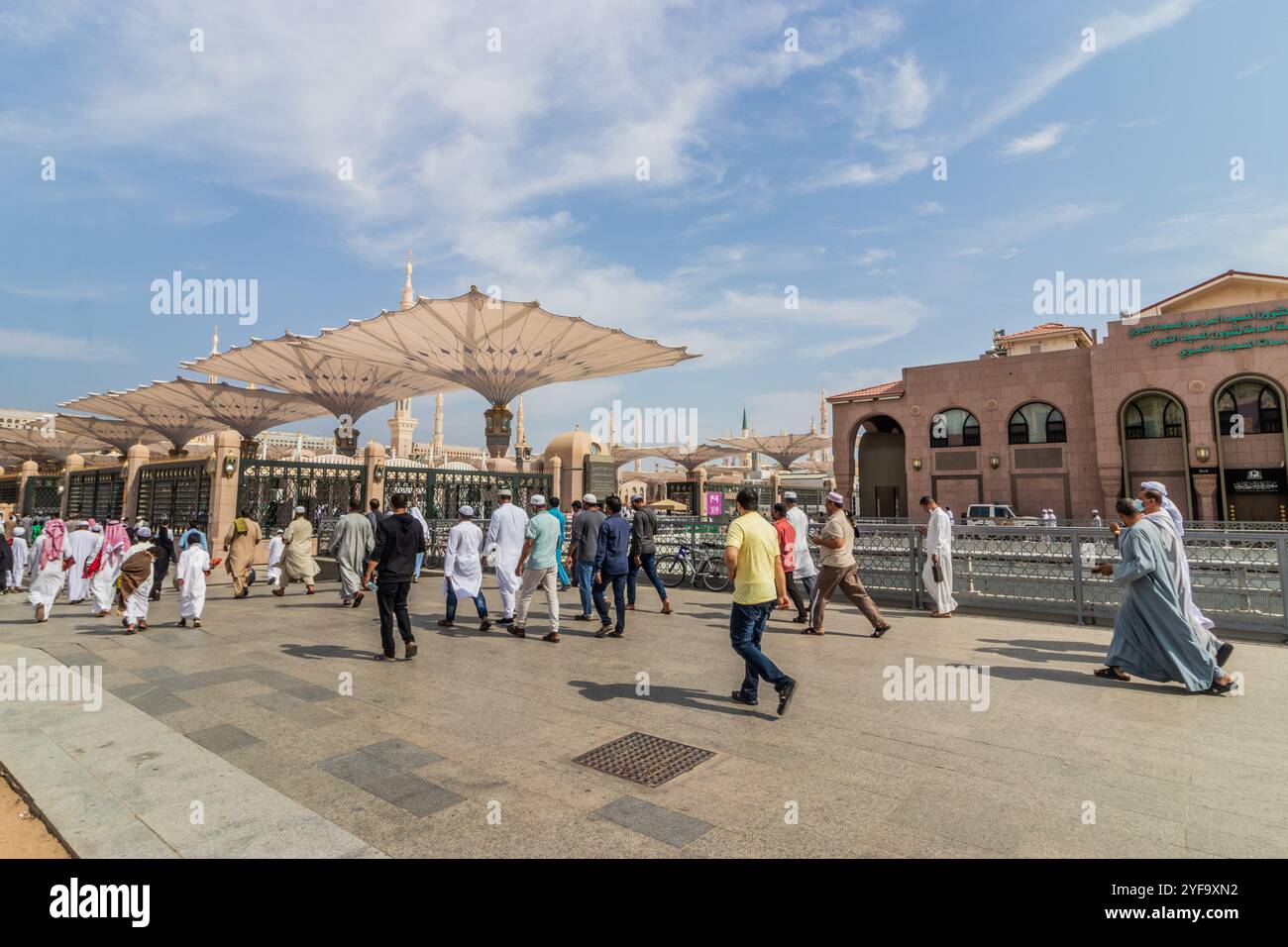 MEDINA, SAUDI ARABIA - NOVEMBER 12, 2021: Devotees on their way to a ...