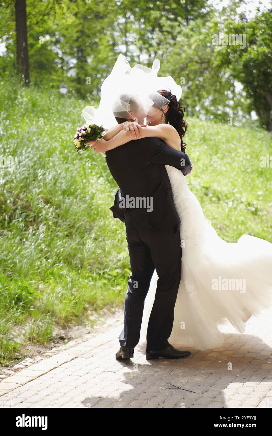 Romantic wedding hugs of the newlyweds Stock Photo - Alamy