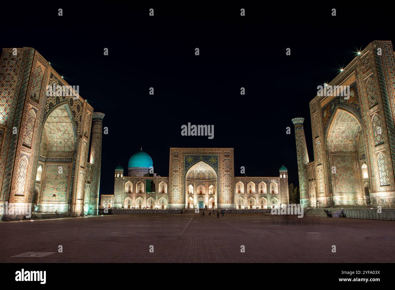 Evening view of the Registan Square in Samarkand, Uzbekistan. The Ulugh ...