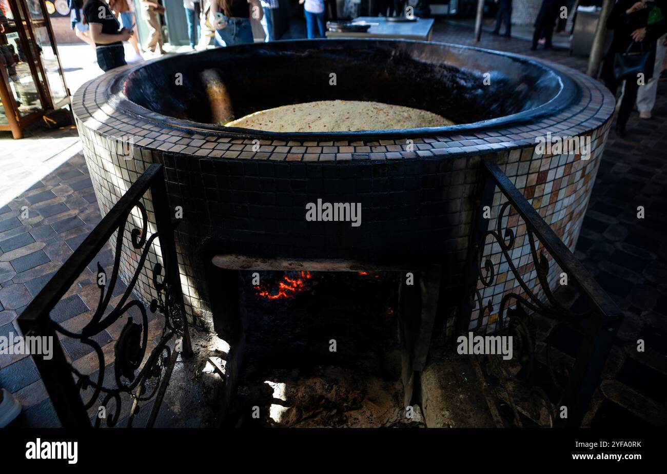 Real Uzbek pilaf in a huge cauldron. Center for pilaf in Tashkent ...
