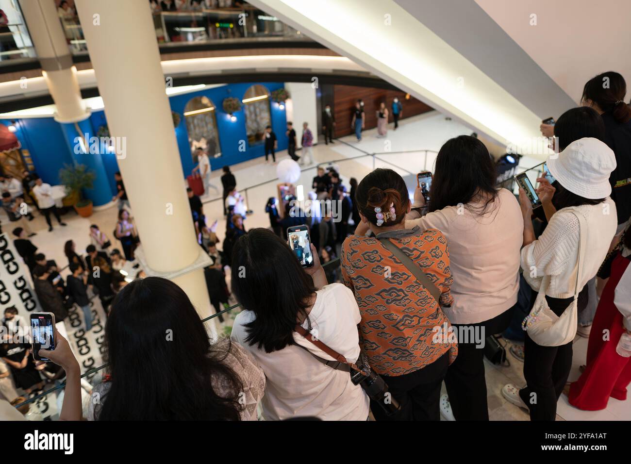 BANGKOK, THAILAND - OCTOBER 27, 2023: women taking video at Gaysorn Atrium Gallery in Bangkok ...
