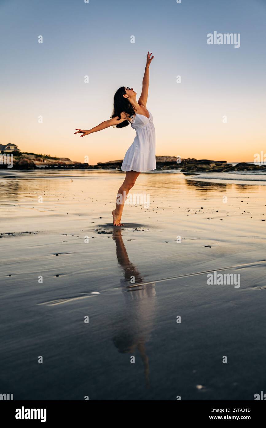 Woman dancing gracefully sunset beach hi-res stock photography and ...