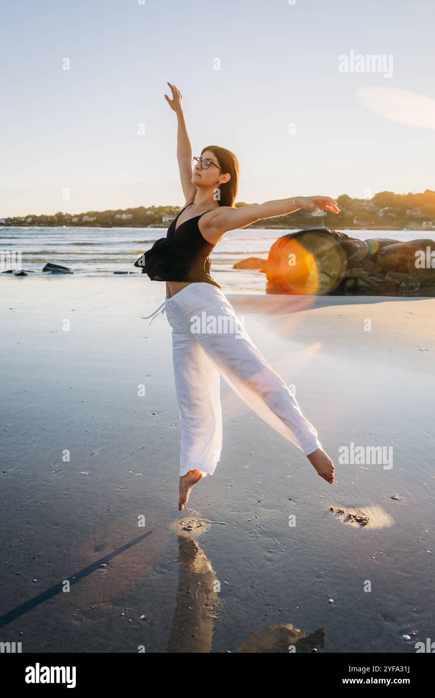 Woman dancing gracefully sunset beach hi-res stock photography and ...