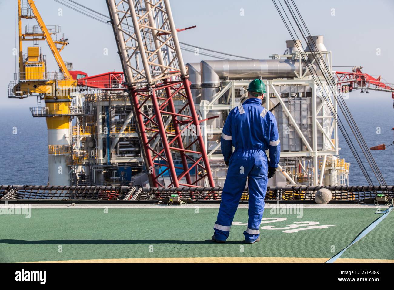 Oil worker on an offshore oil rig in the north sea Stock Photo - Alamy