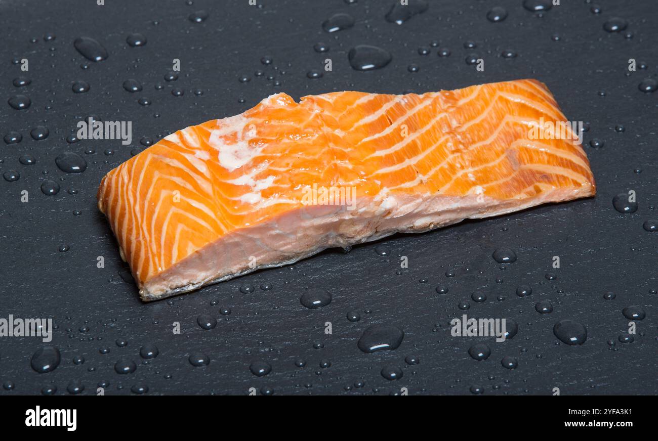 Scottish Salmon fillet on a black slate Stock Photo - Alamy