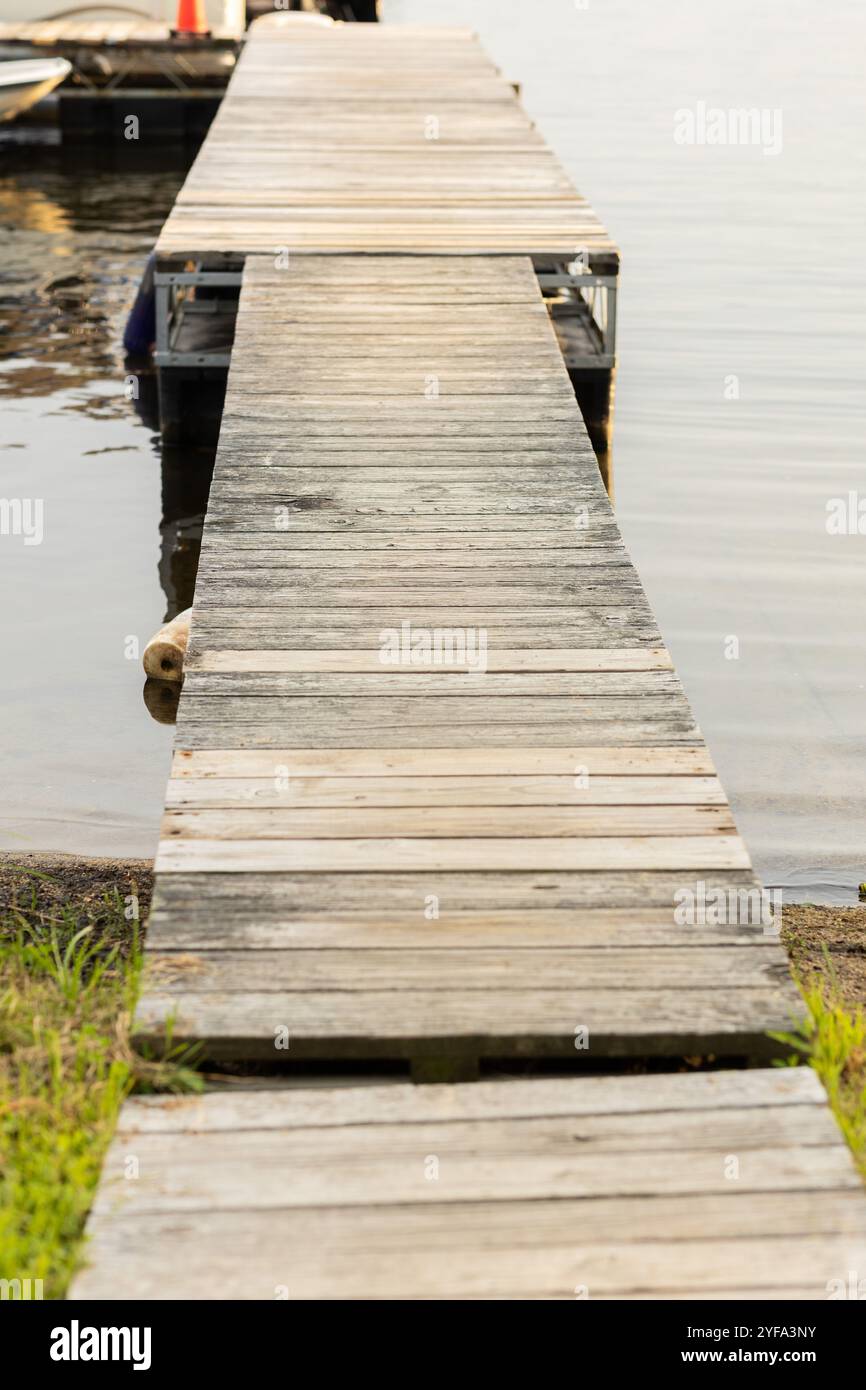 Vertical image of boat dock in a lake Stock Photo - Alamy