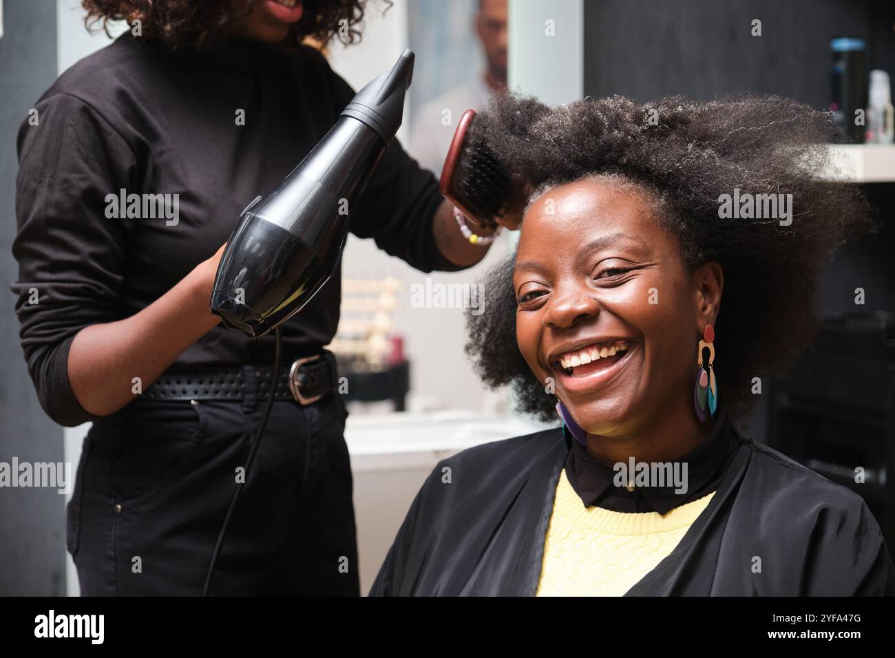 Professional hairdresser drying womans hair hi-res stock photography ...