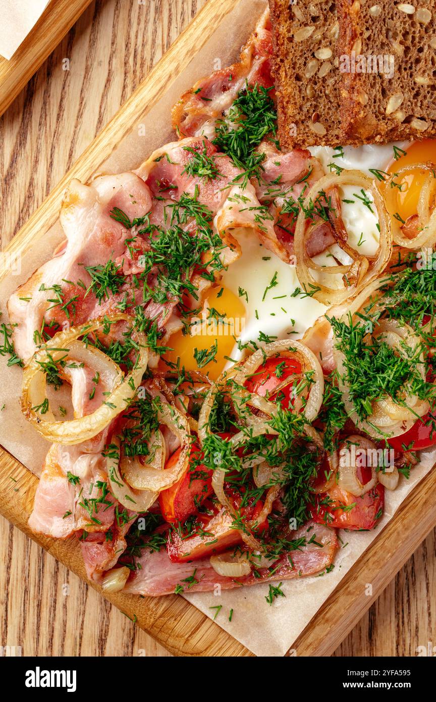 English breakfast with egg, bacon, vegetables and bread Stock Photo - Alamy