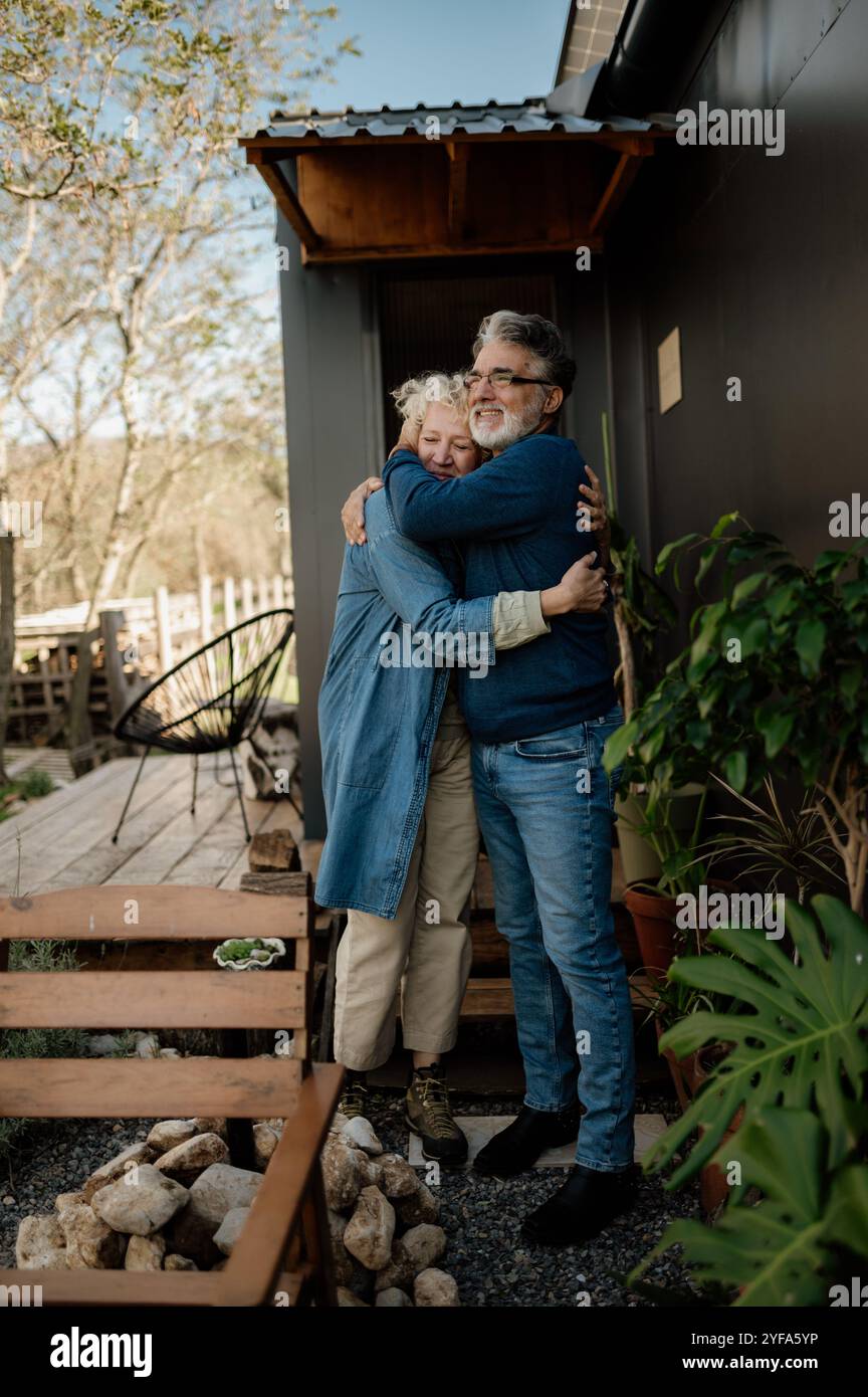 Portrait of loving mature couple hugging in the garden Stock Photo - Alamy