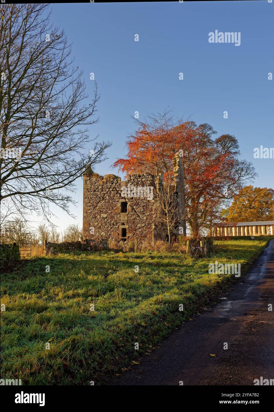 Ballinshoe Castle seen by the side of a small rural road with a hay ...
