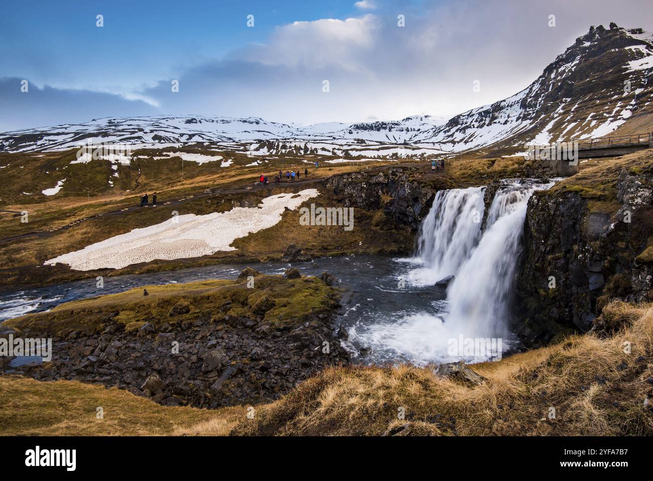 The Kirkjufell mountain and the kirkjufellfoss waterfall at ...