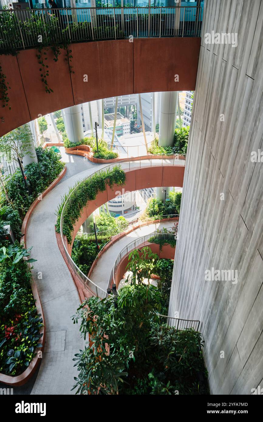 Singapore - August 16, 2024: CapitaSpring skyscraper with walkways and ...