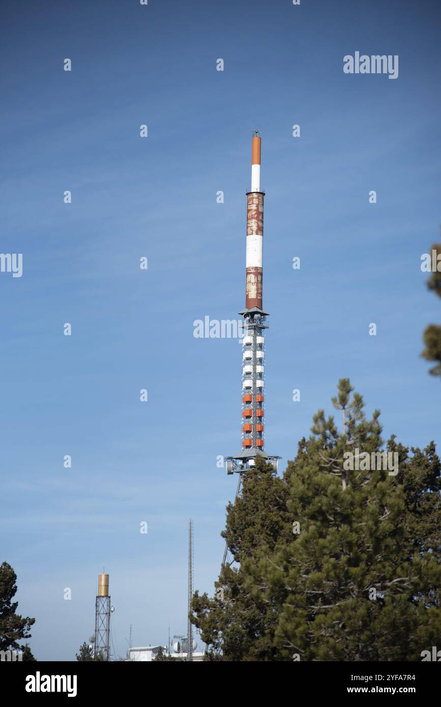 Communication tower on a building with 4G 5G antenna and satellite dish ...