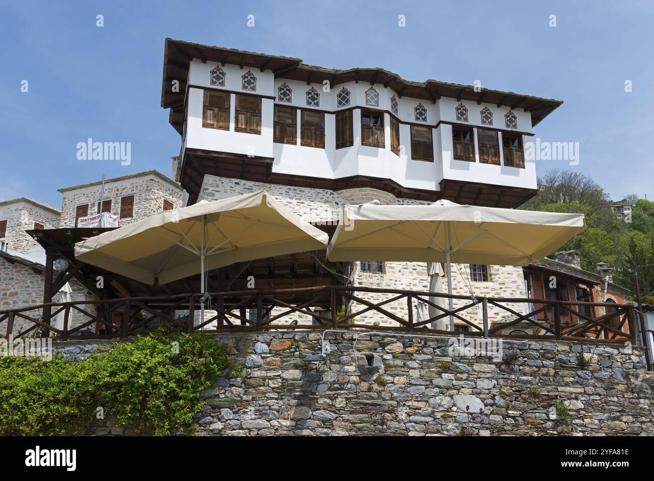 Building with balconies and parasols, traditional architecture with ...