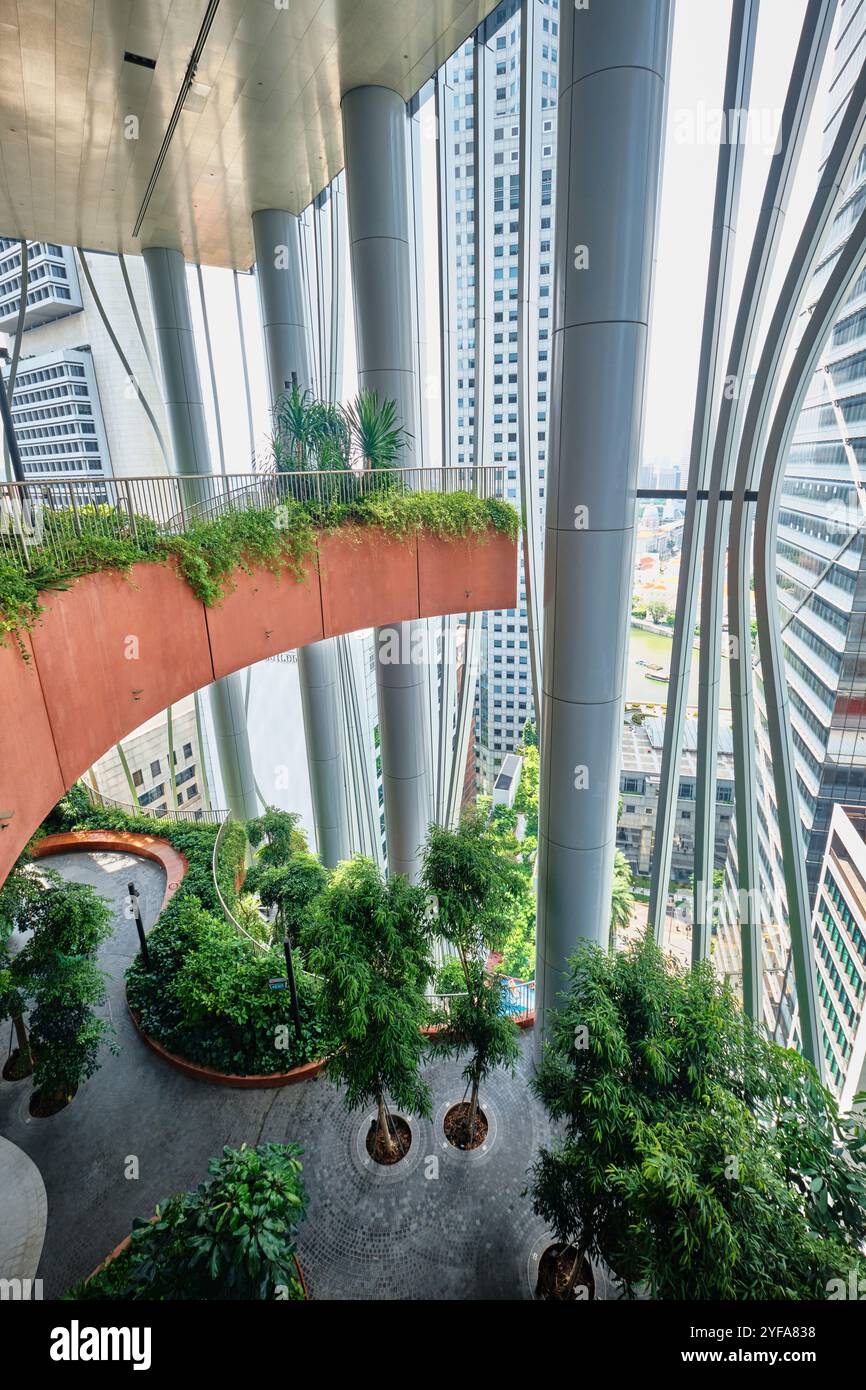 Singapore - August 16, 2024: CapitaSpring skyscraper with walkways and ...