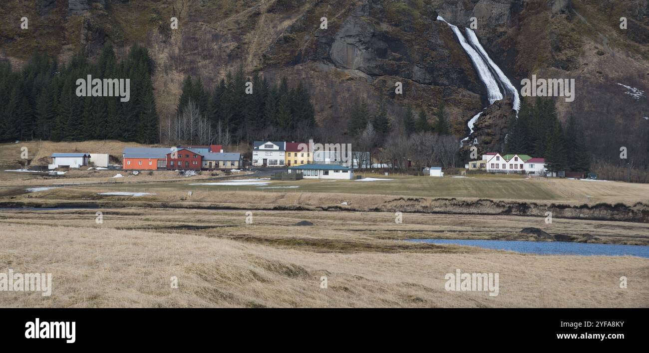 The Systrafoss waterfall running down the cliff side above ...