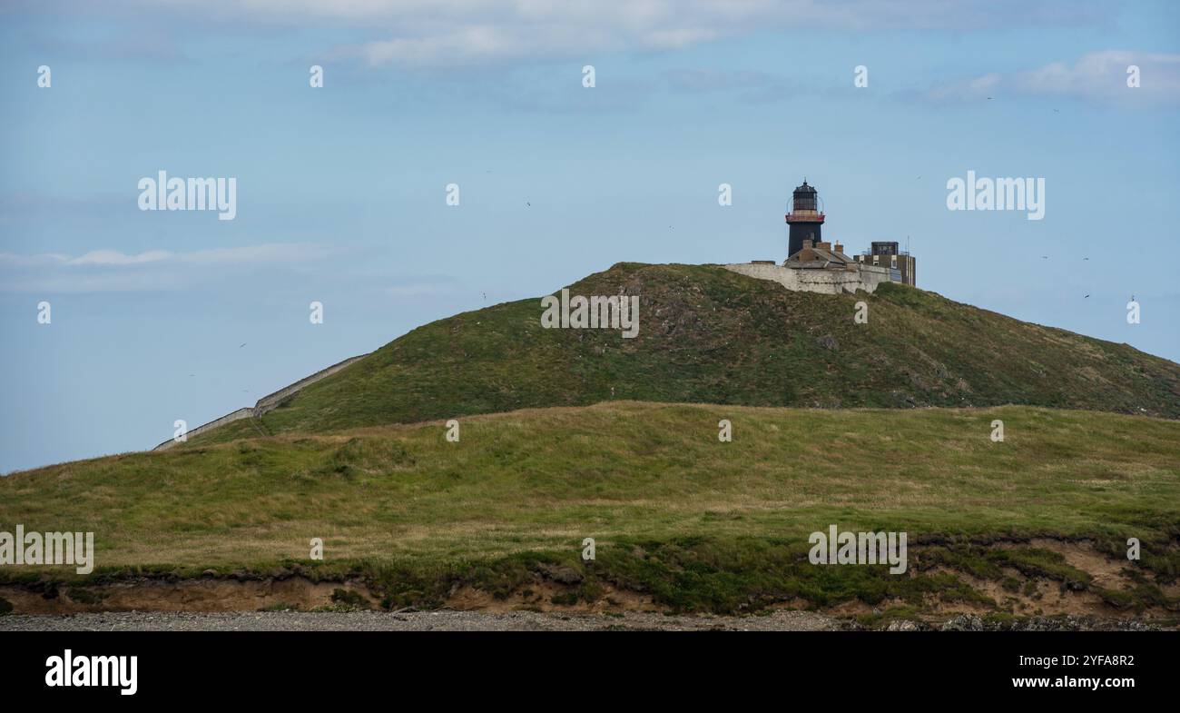 Bellycotton black lighthouse in the ocean in ireland Stock Photo - Alamy