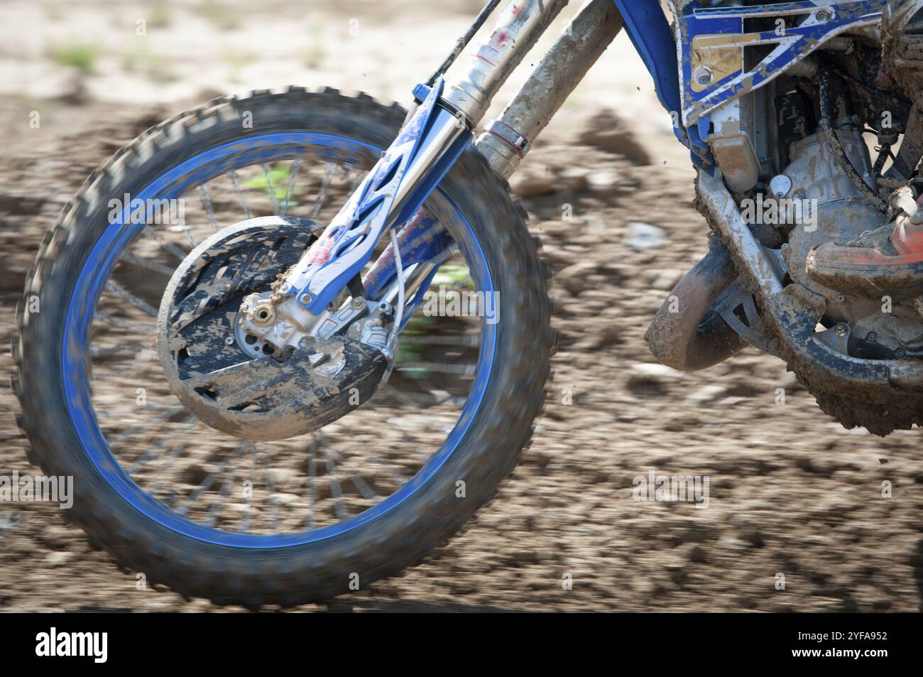 Wheel of a racing motorcycle on a muddy track. Motor athlete on a ...
