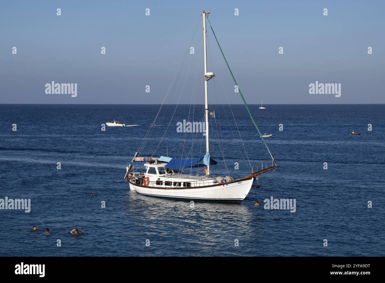 Tourist yachts with people sailing in the sea. Summer holidays in the ...