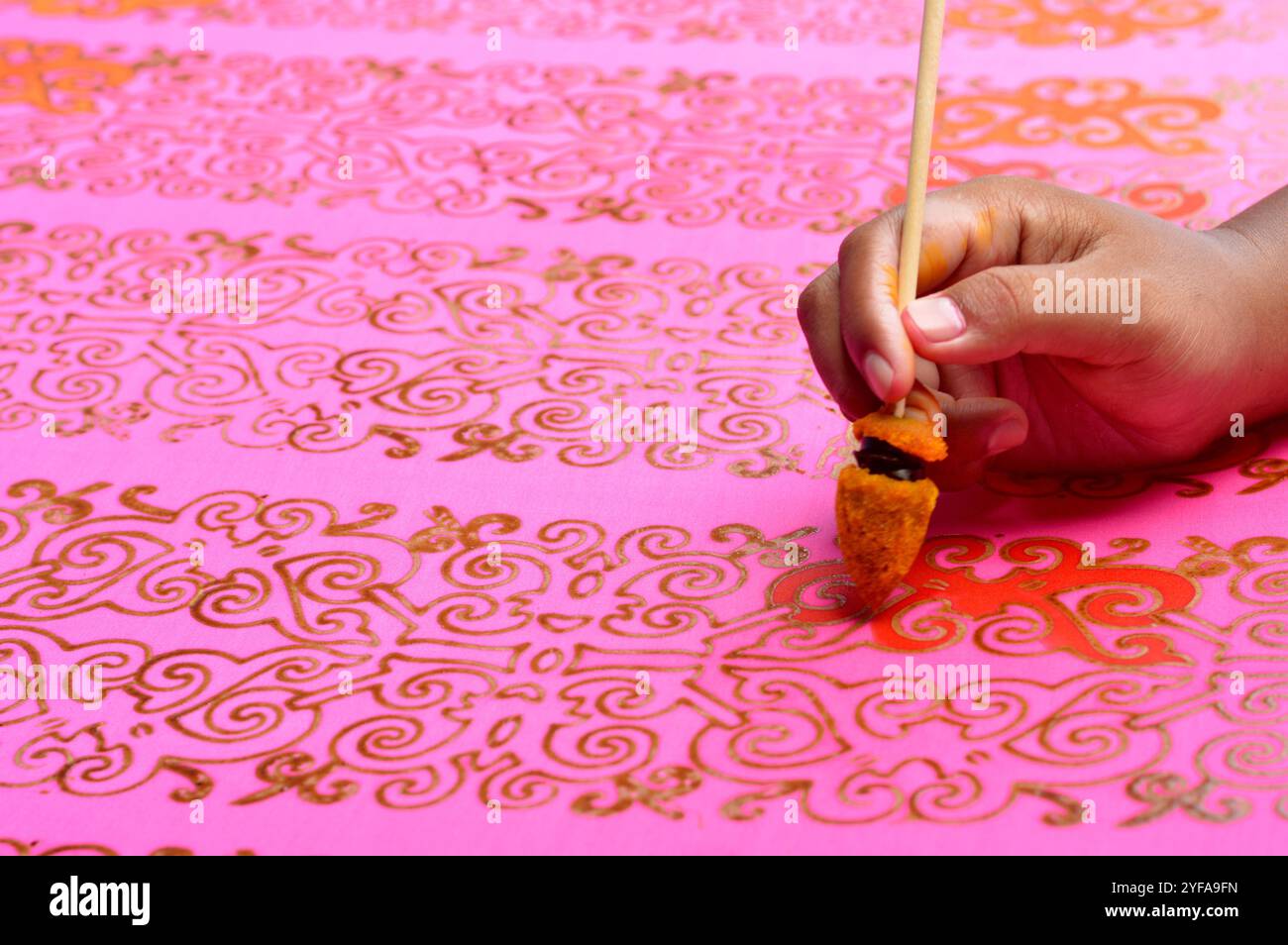 coloring process on Indonesian batik cloth Stock Photo - Alamy