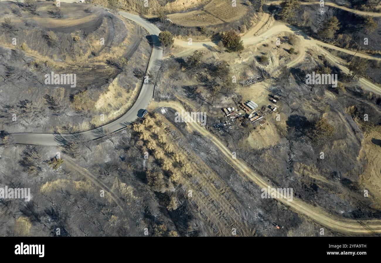 Mountain fire with burned agriculture land and forest. Odou village ...