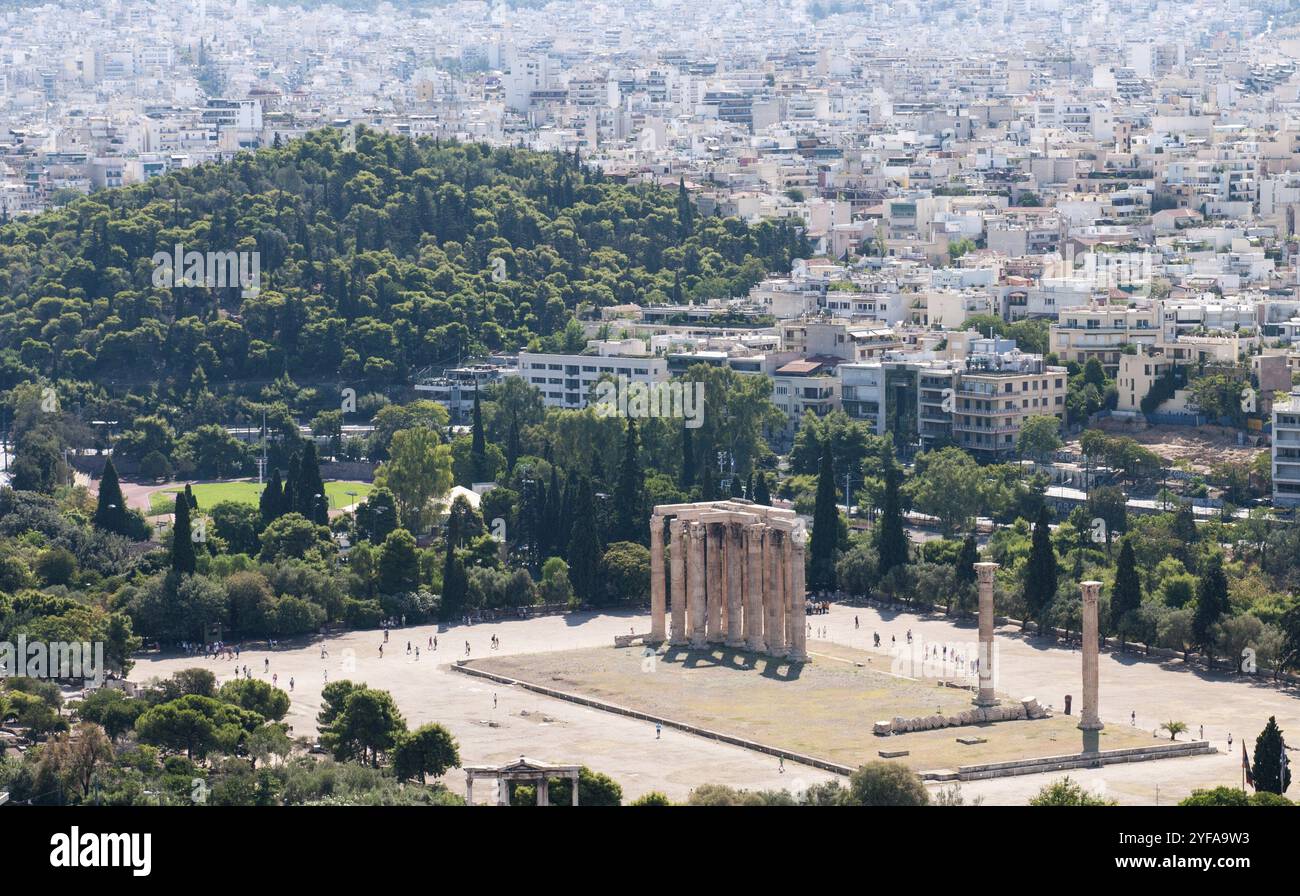 Ruins of the historical ancient temple of olympian zeus and Athens cityscape, from the Acropolis ...