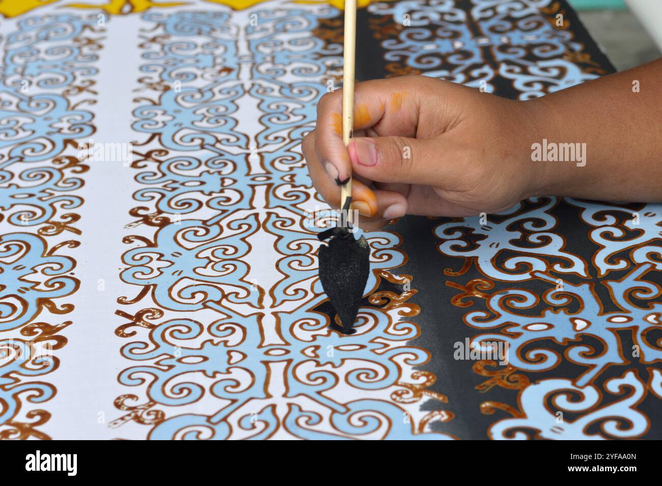 coloring process on Indonesian batik cloth Stock Photo - Alamy