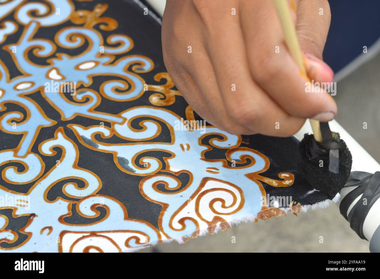coloring process on Indonesian batik cloth Stock Photo - Alamy